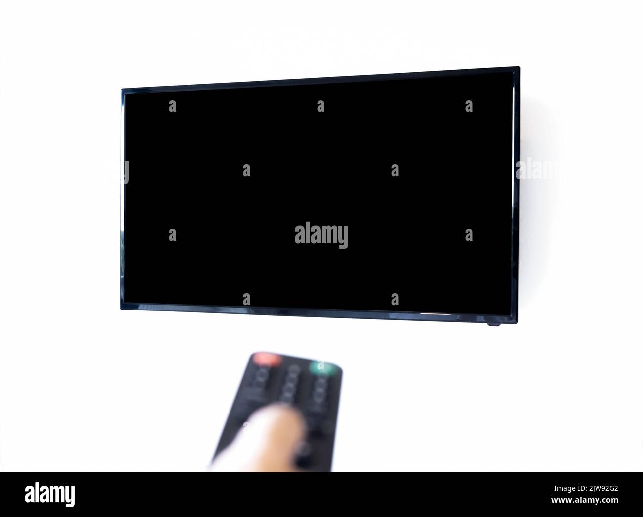 View of mockup black blank space on TV screen isolated on white wall ...