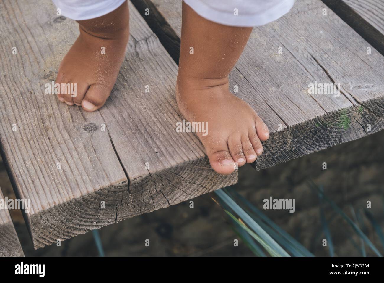 Foot barefoot baby leg sandy hi-res stock photography and images - Alamy