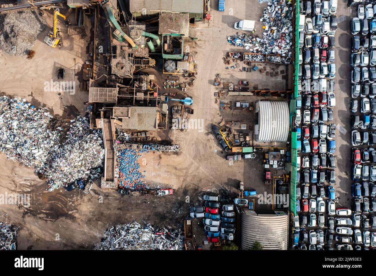 An aerial view directly above a scrapyard or junkyard recycling and ...