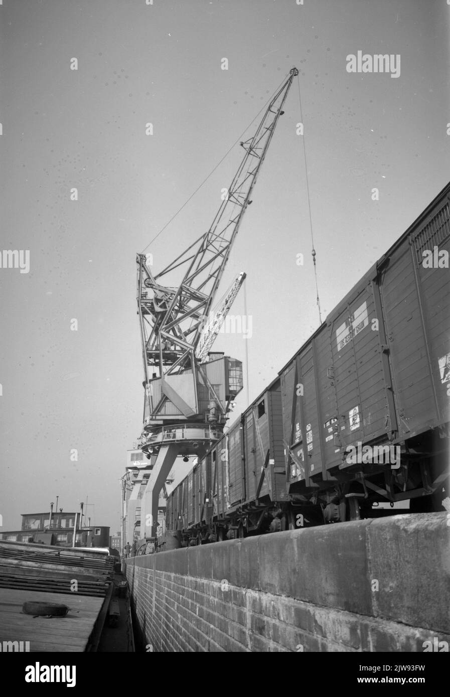 Image of the transfer of goods from train to ship in the port in ...