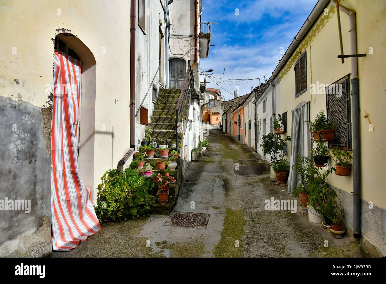 A narrow street in Calitri, a picturesque village in the province of Avellino in Campania, Italy ...