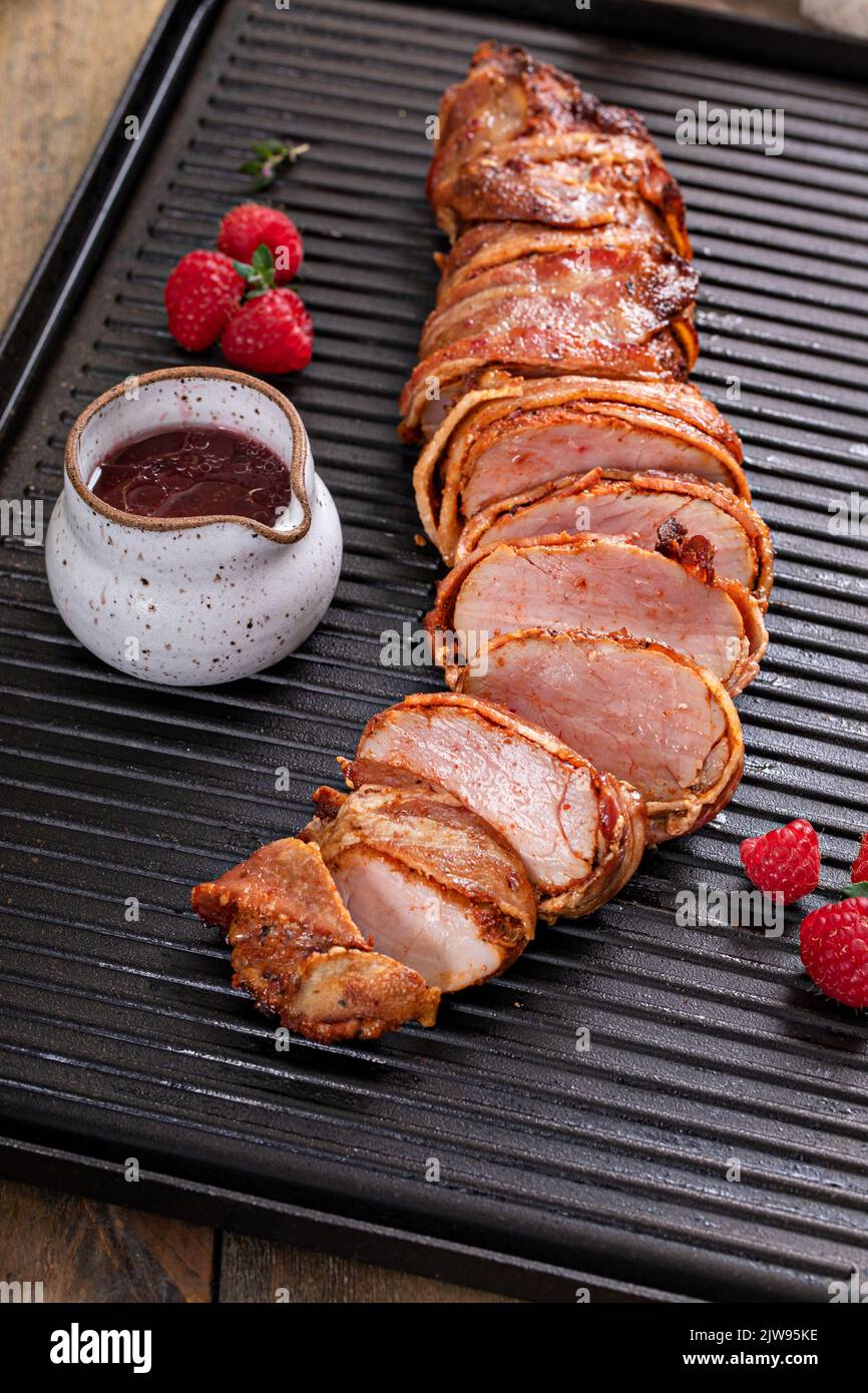 Pork tenderloin wrapped in bacon with raspberry vinaigrette Stock Photo ...
