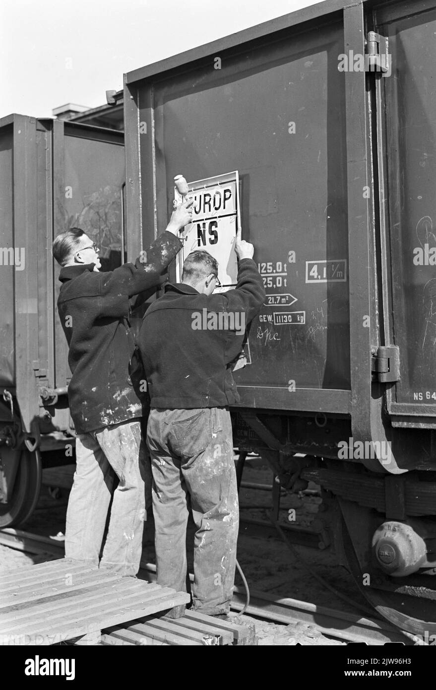 Image of applying Europe inscriptions on an open freight car from the N ...