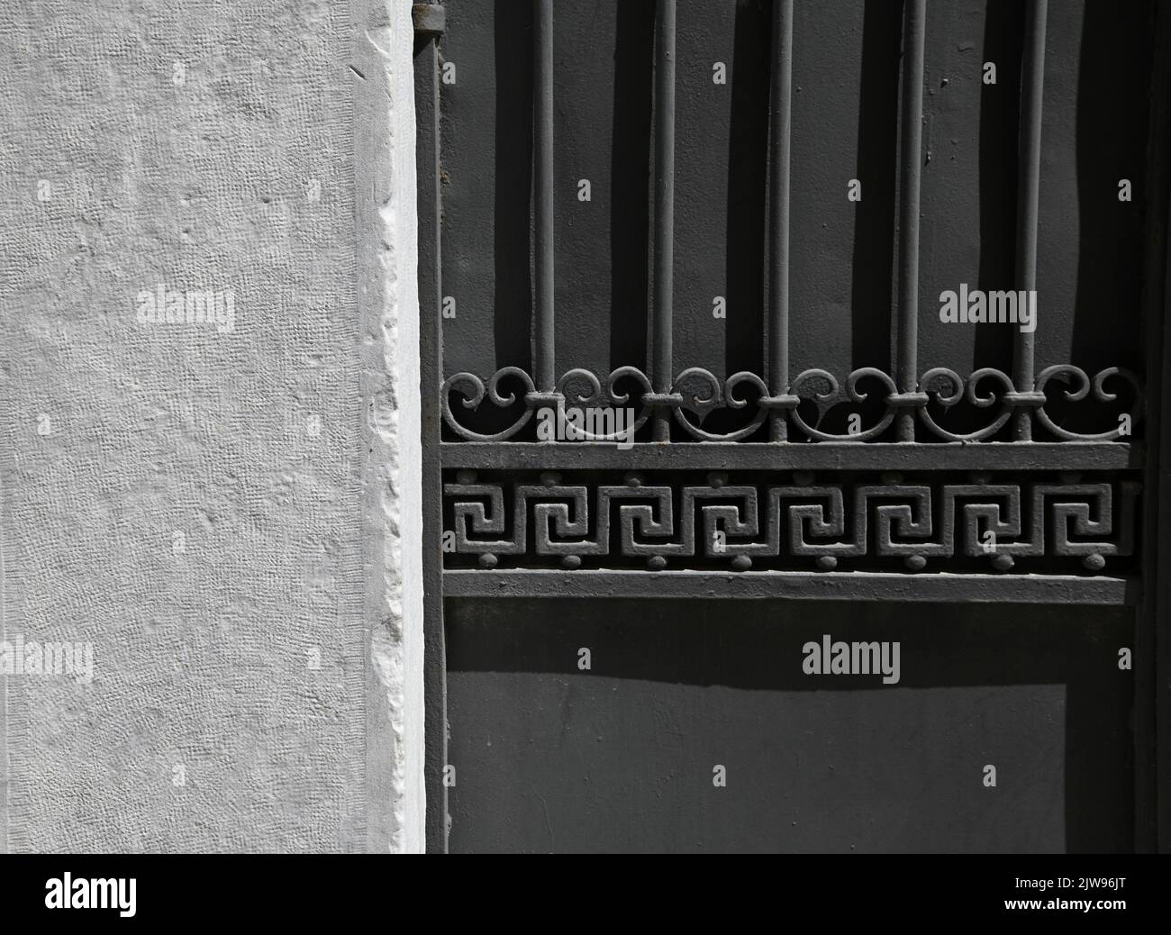 Old Neoclassical house handcrafted charcoal grey metal door with a ...