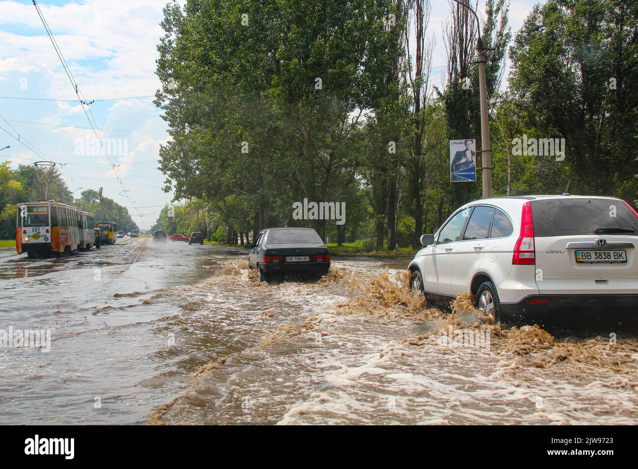 Flood. Road and cars under water. Heavy rain and downpour flooded city ...