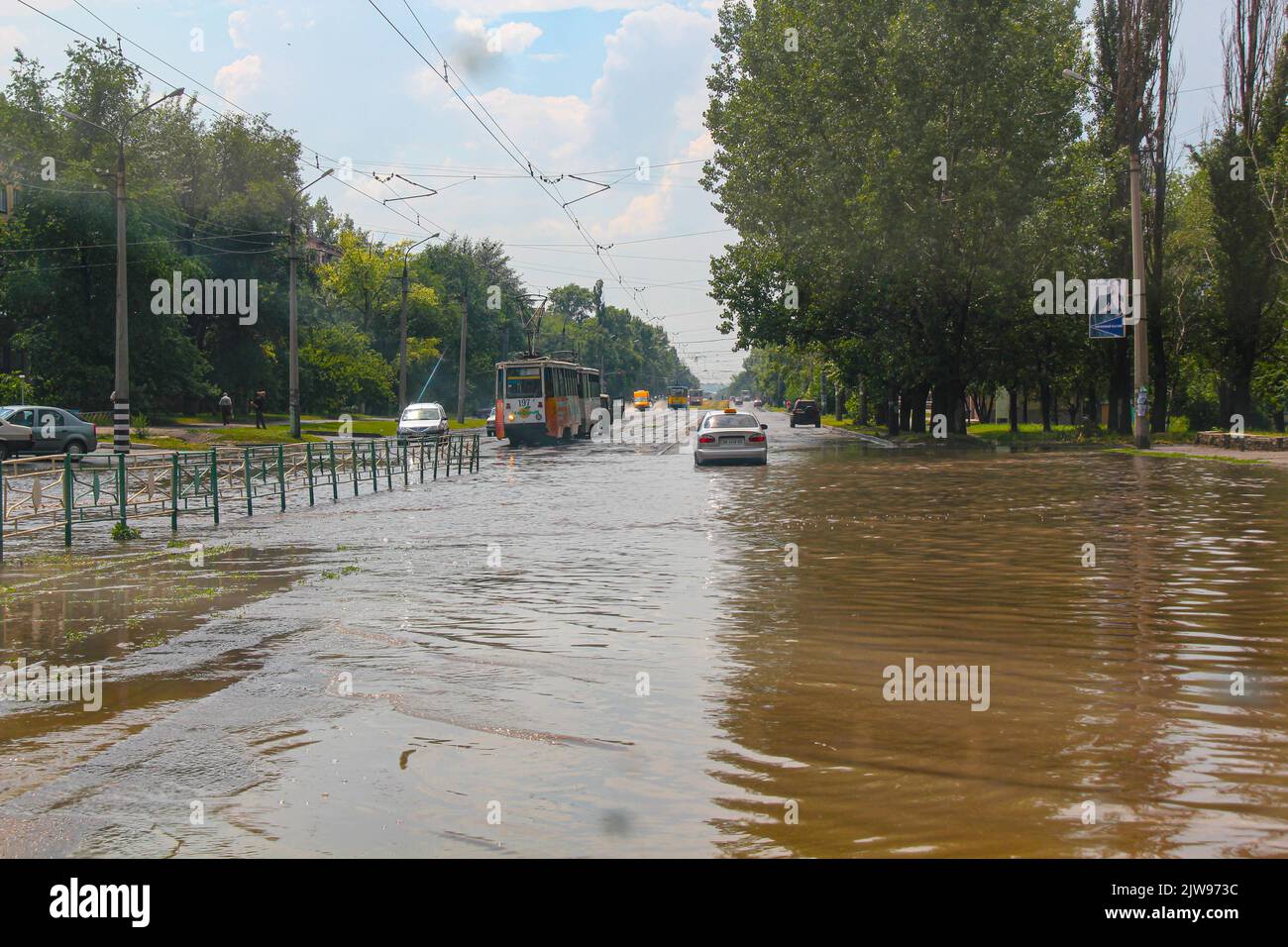 Flood. Road and cars under water. Heavy rain and downpour flooded city ...