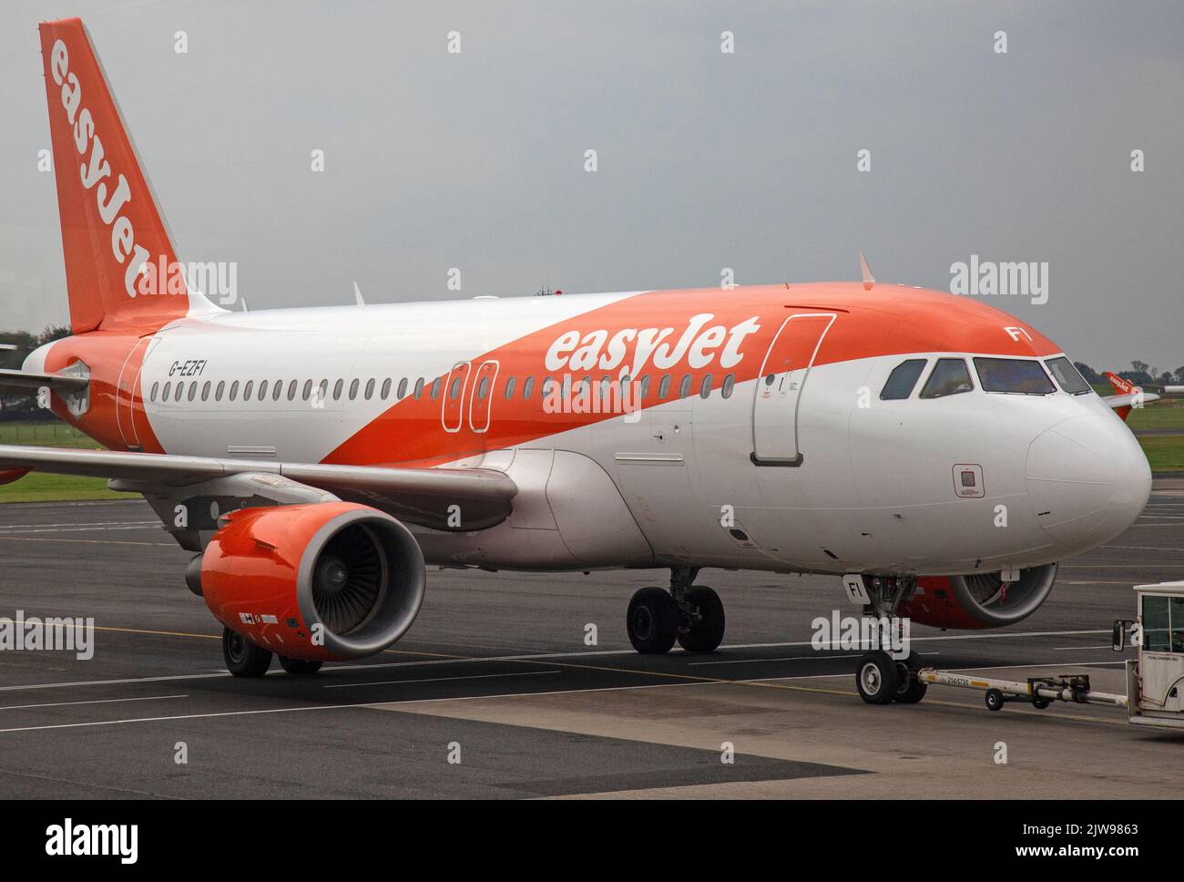 An easyJet Airbus A319, G-EZFI, at Belfast International Airport, Northern Ireland Stock Photo ...