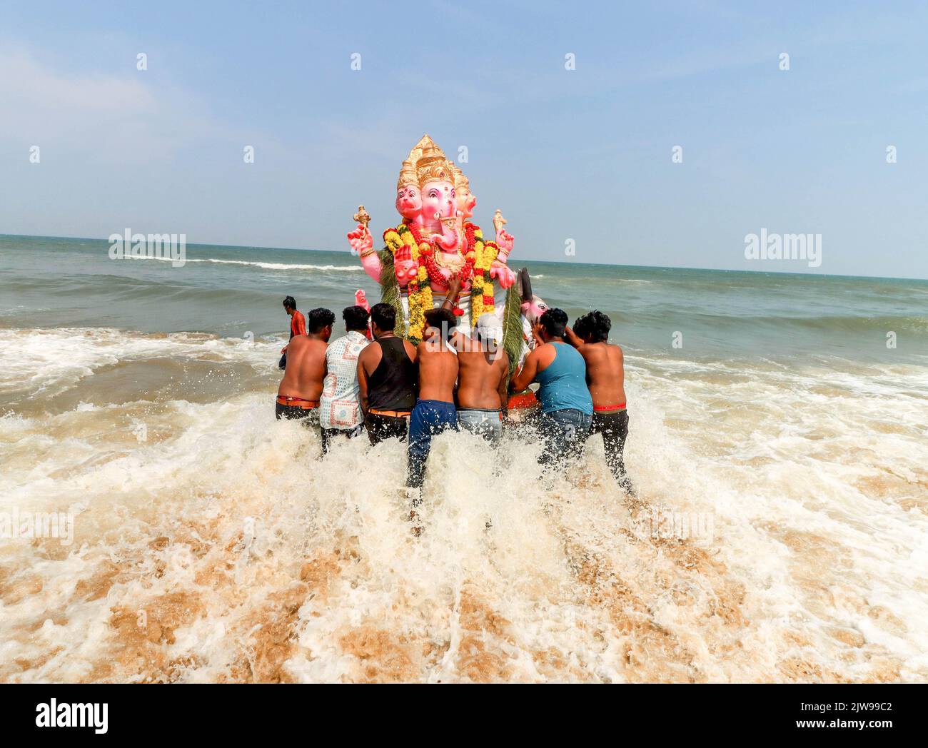 Chennai, India, 4th Sep 2022: wave hits the people who are doing the ...
