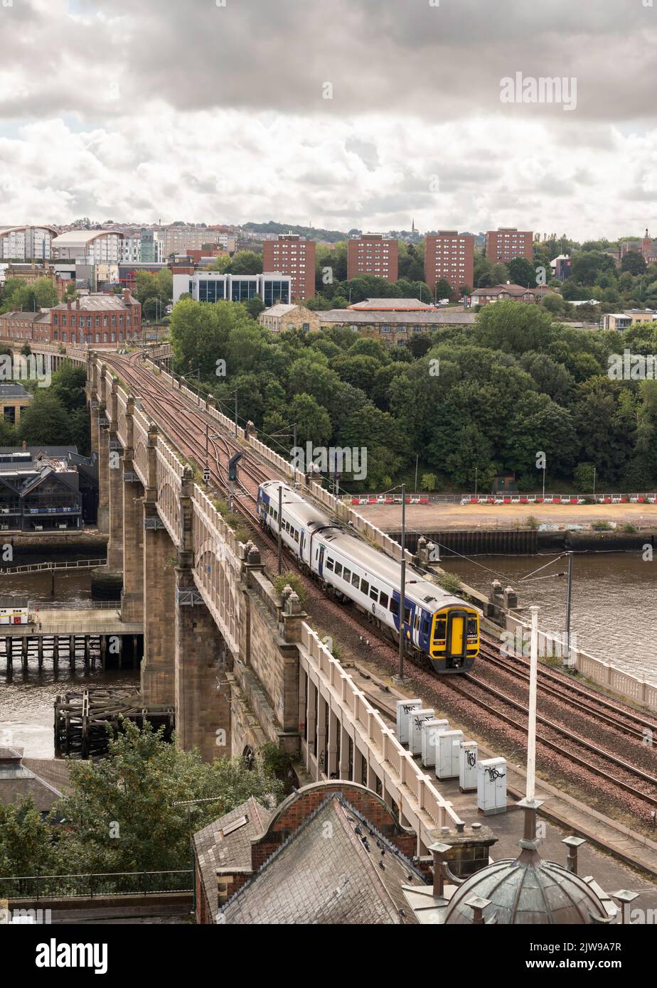 Northern Rail diesel train crossing the high level bridge from ...