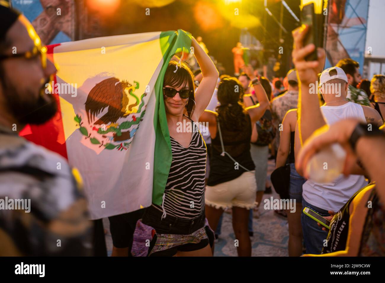 Crowd listens and dances with Mexican band Instituto Mexicano del ...