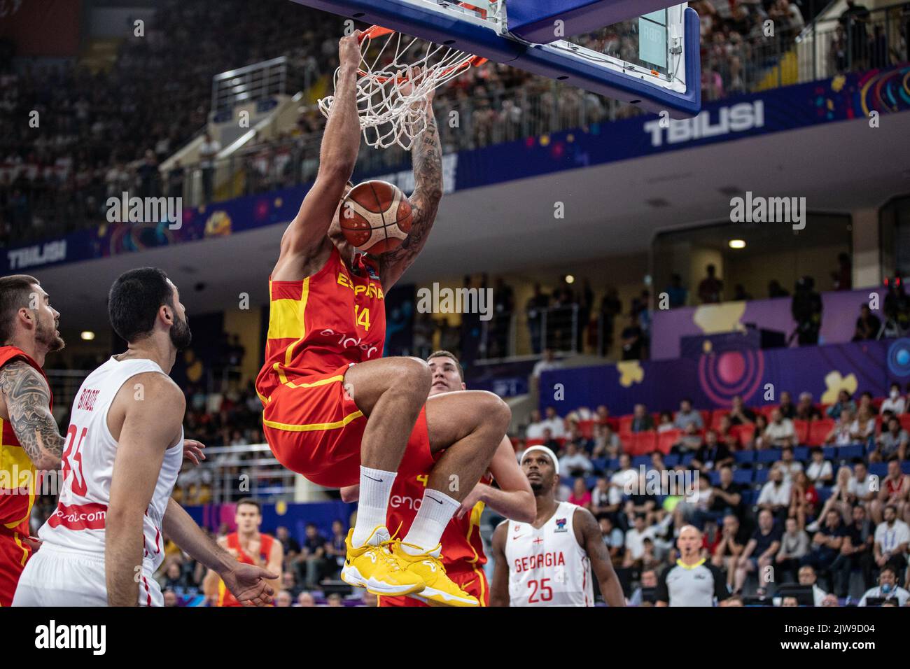 Willy Hernangomez (L) of Spain and Giorgi Shermadini (R) of Georgia ...