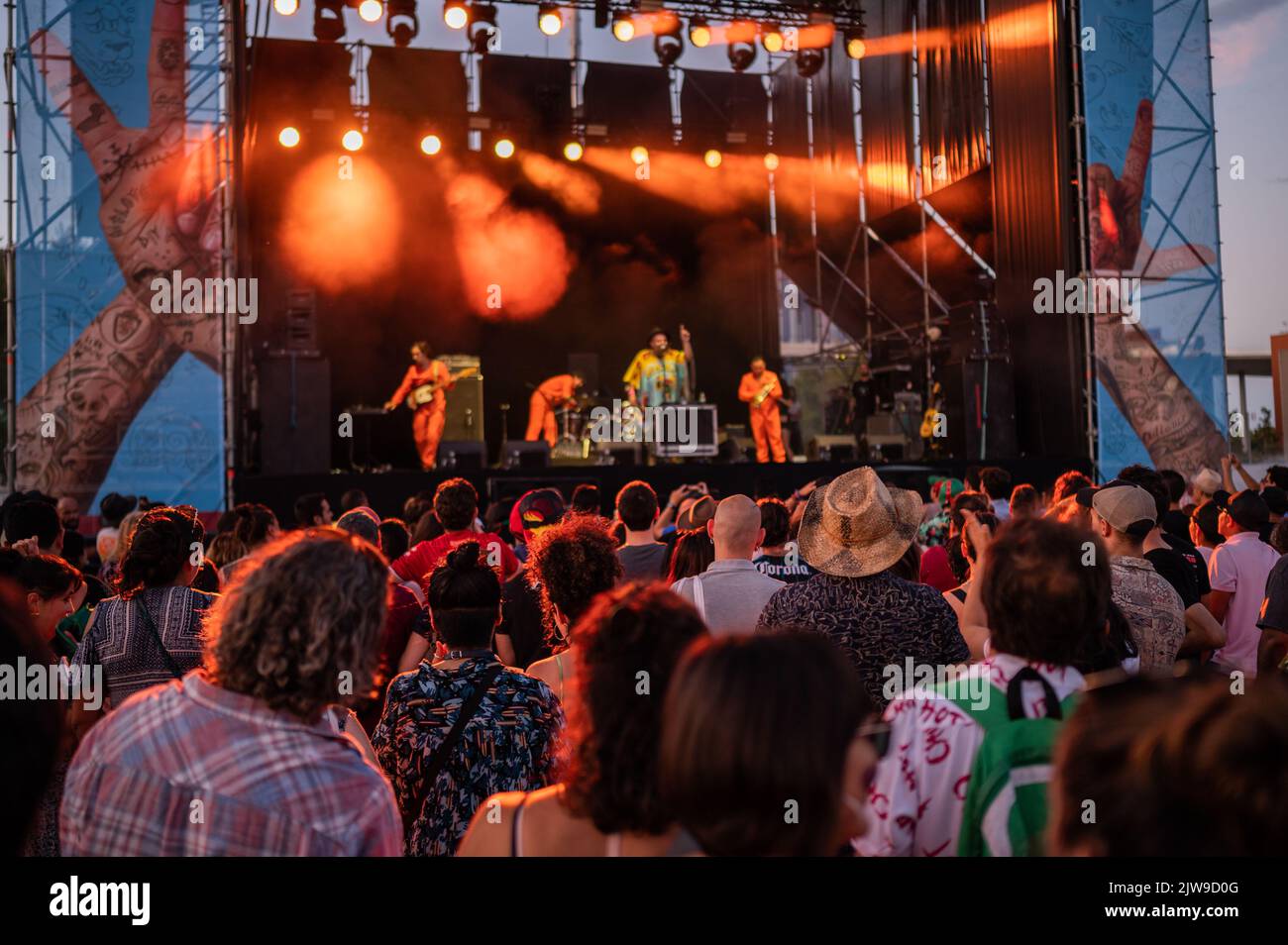 Crowd listens and dances with Mexican band Instituto Mexicano del ...