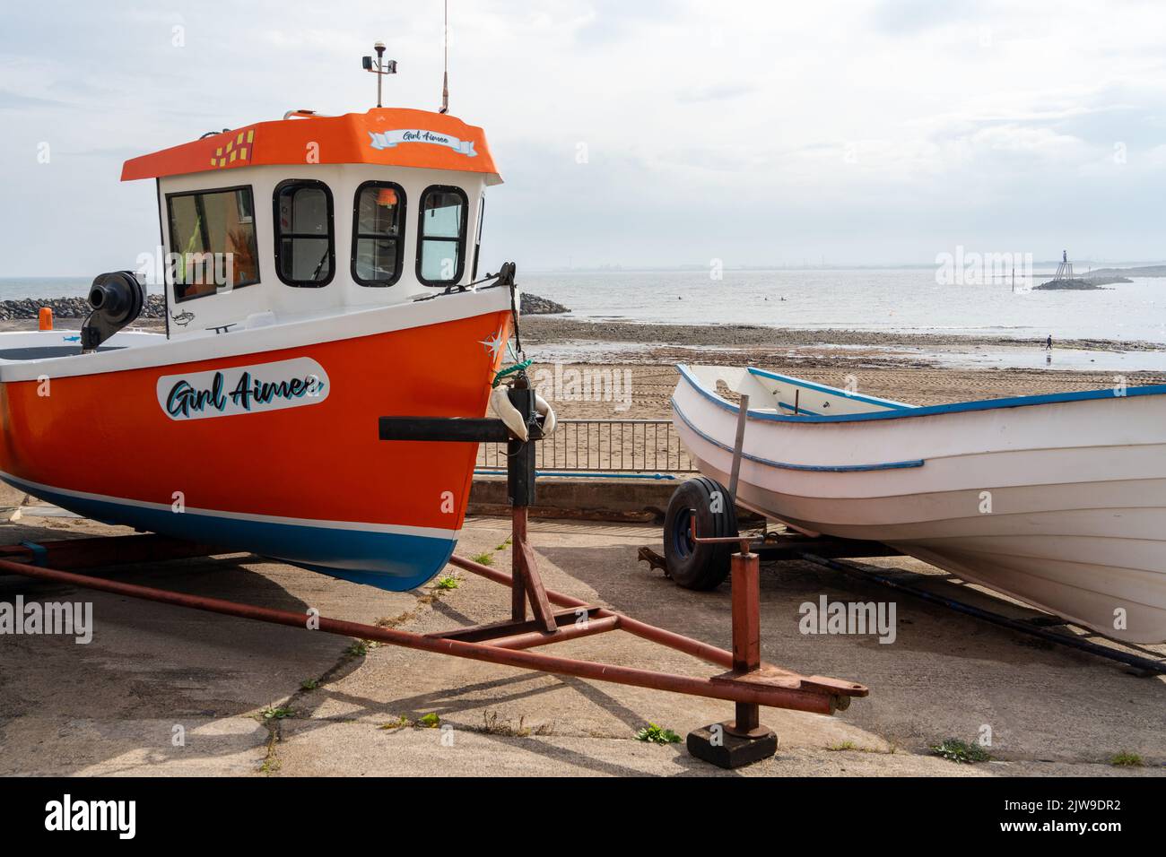 The pretty fishing boat Girl Aimee on shore near the beach at Newbiggin ...
