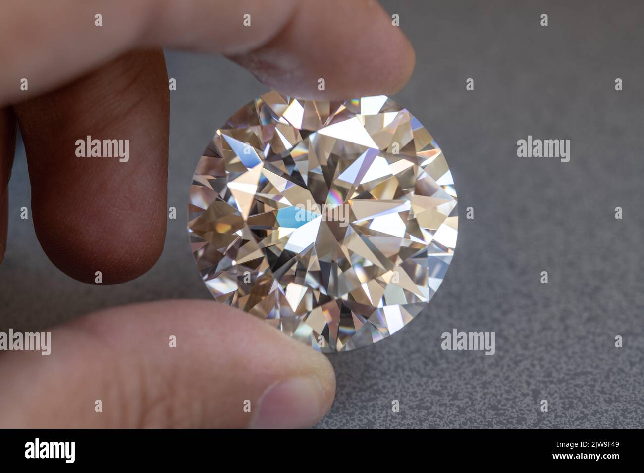 Round Cut Big Carat Diamond Gemstone on Hand Stock Photo - Alamy