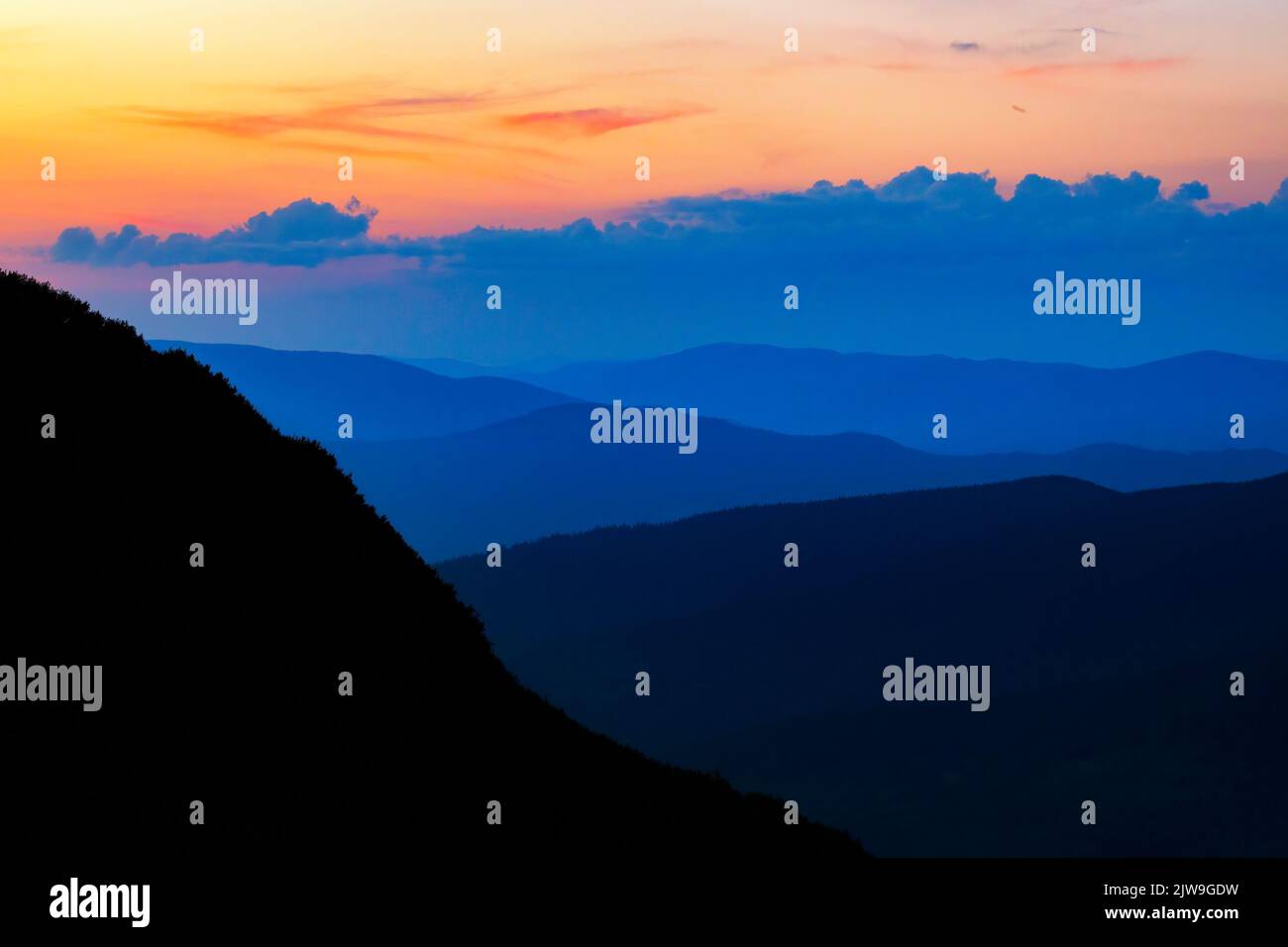 Colorful mountain silhouettes at the sunset. Vibrant mountain photo ...