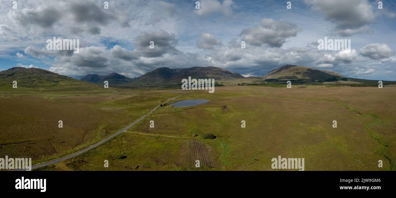 drone panorama landscape of Connemara National Park and the Twelve Bens ...