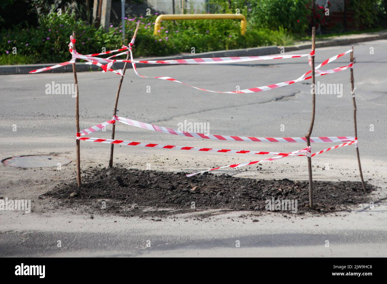 Defocus repair road. Red and white barrier tape protect. Roadwork ...