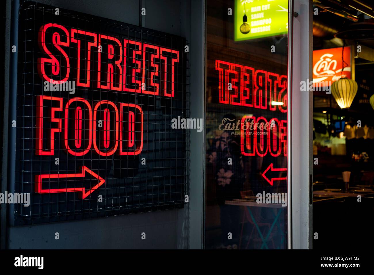 Neon Street Food sign Stock Photo - Alamy