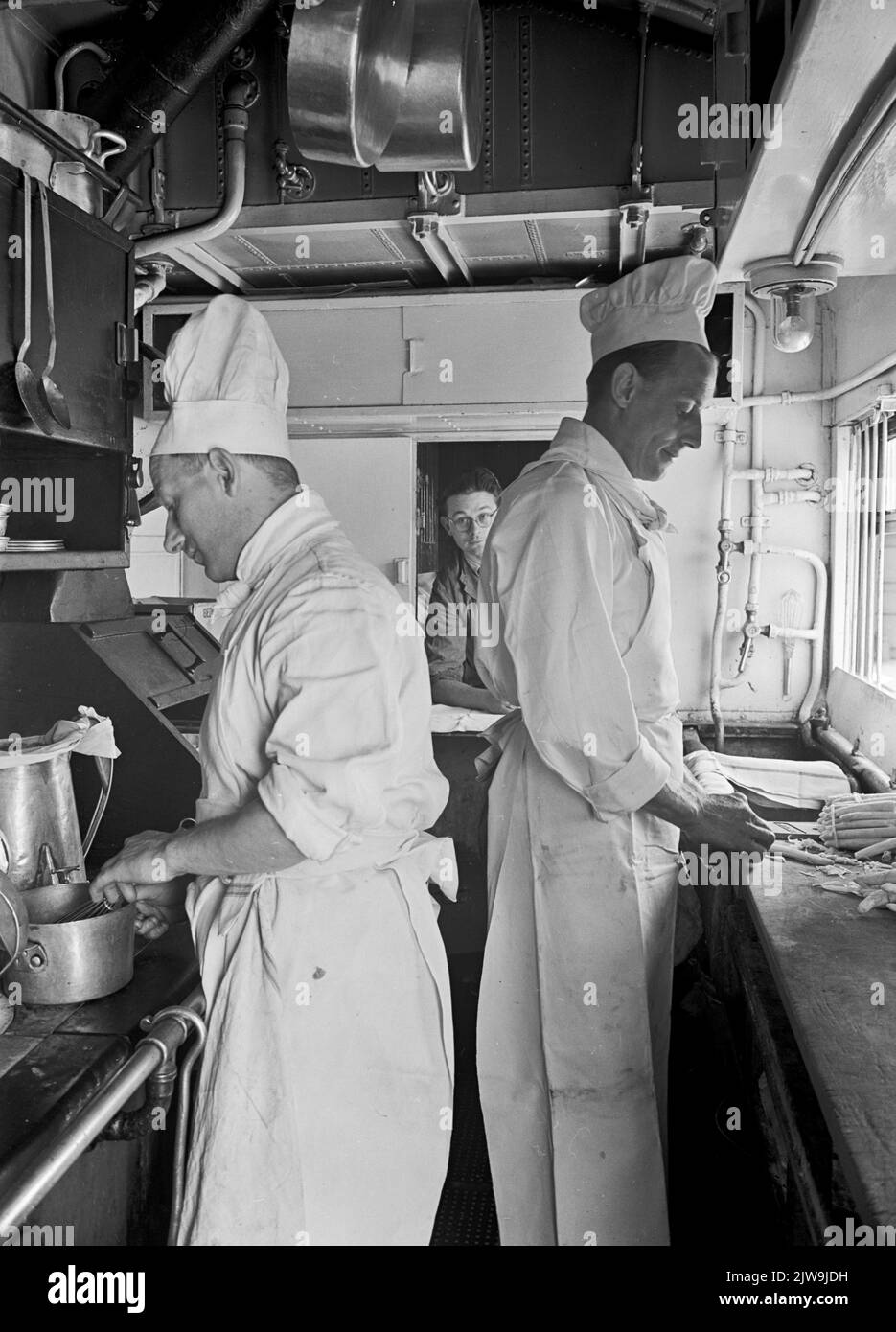 Image of two chefs in the kitchen of a restoration car of Wagons Lits ...