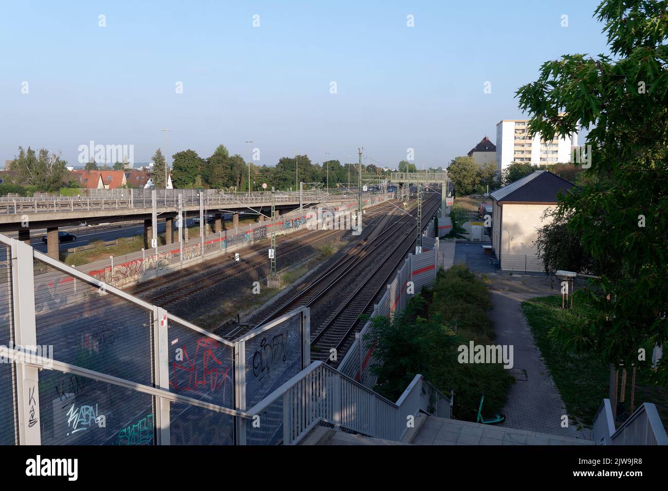 Traffic, railroad tracks and expressway running in parallel Stock Photo ...