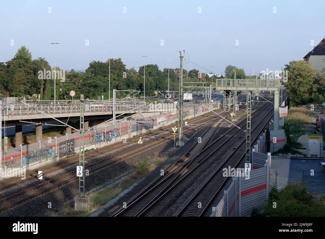 Traffic, railroad tracks and expressway running in parallel Stock Photo ...