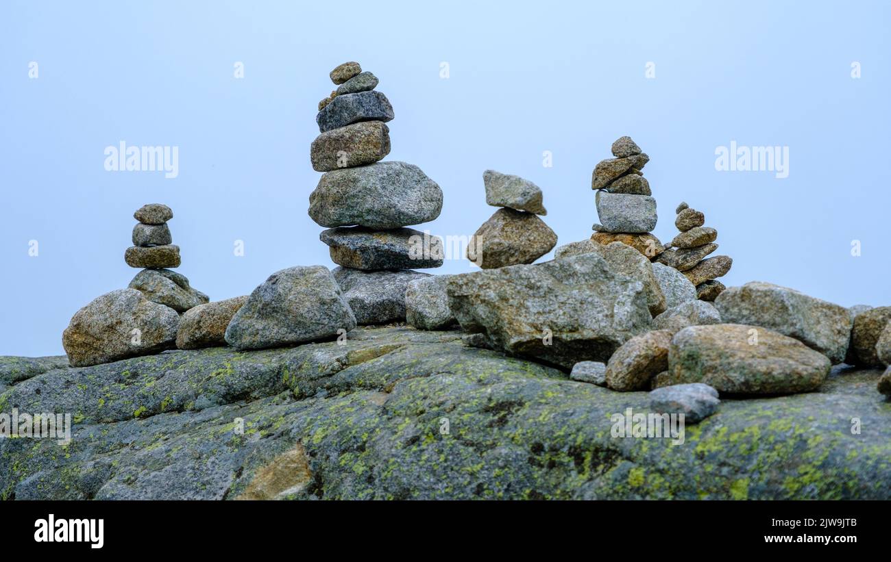 Many stone statues, pyramids are piled on the big rock Stock Photo - Alamy