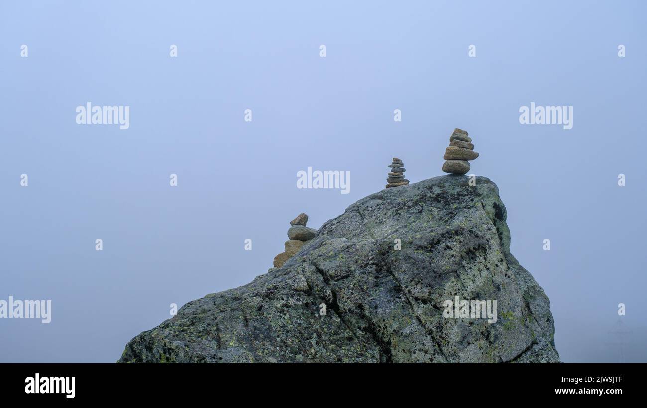 Many stone statues, pyramids are piled on the big rock Stock Photo - Alamy