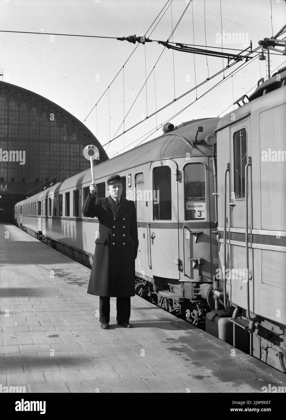 Image of the platform chef who gives the departure signal for a train ...
