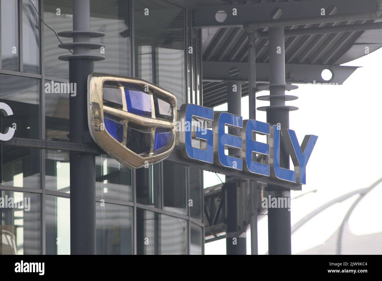The sign of the official dealer of the Geely car brand in St ...
