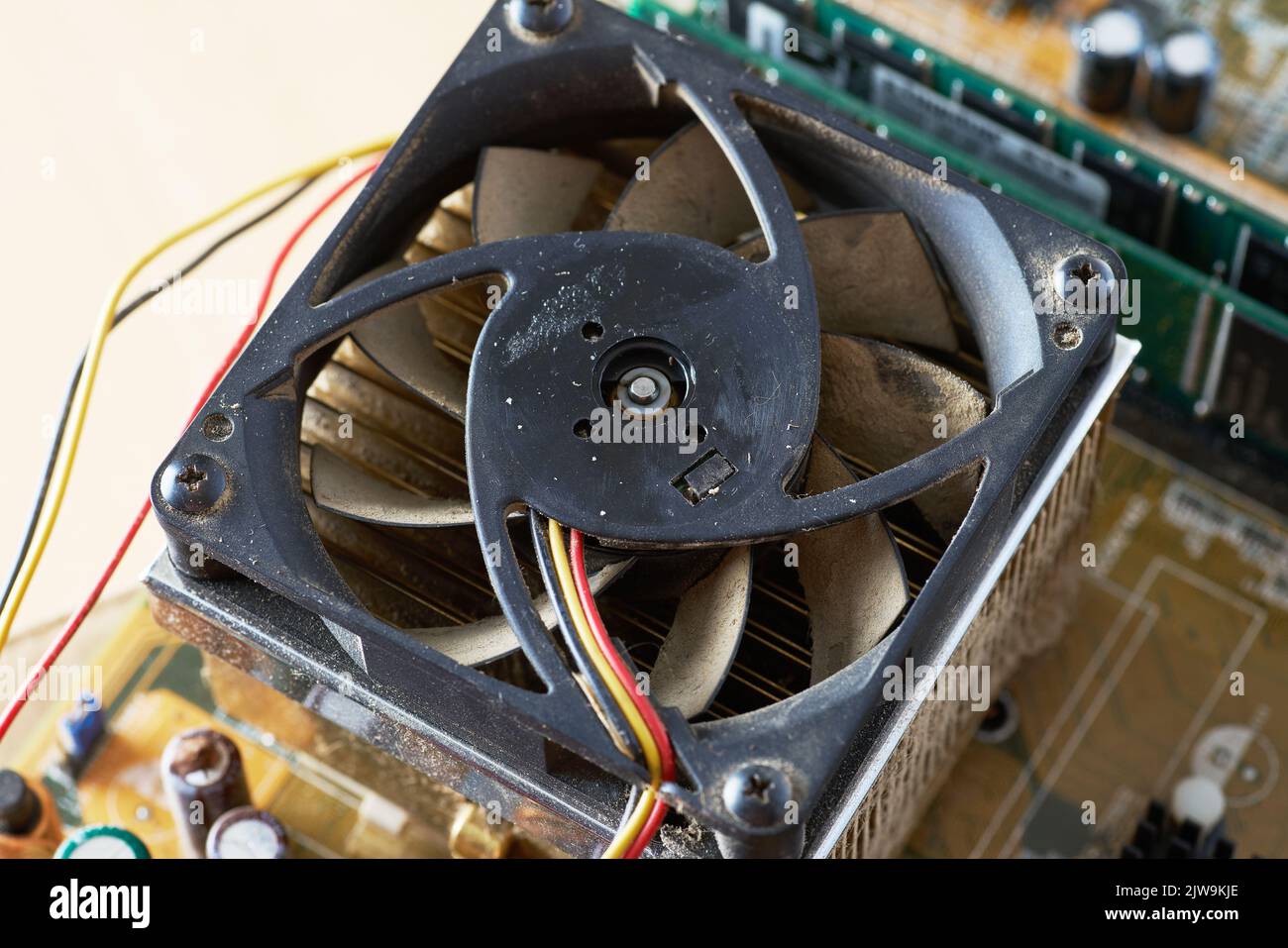 A thick layer of dust covers the internal electronic components of the ...