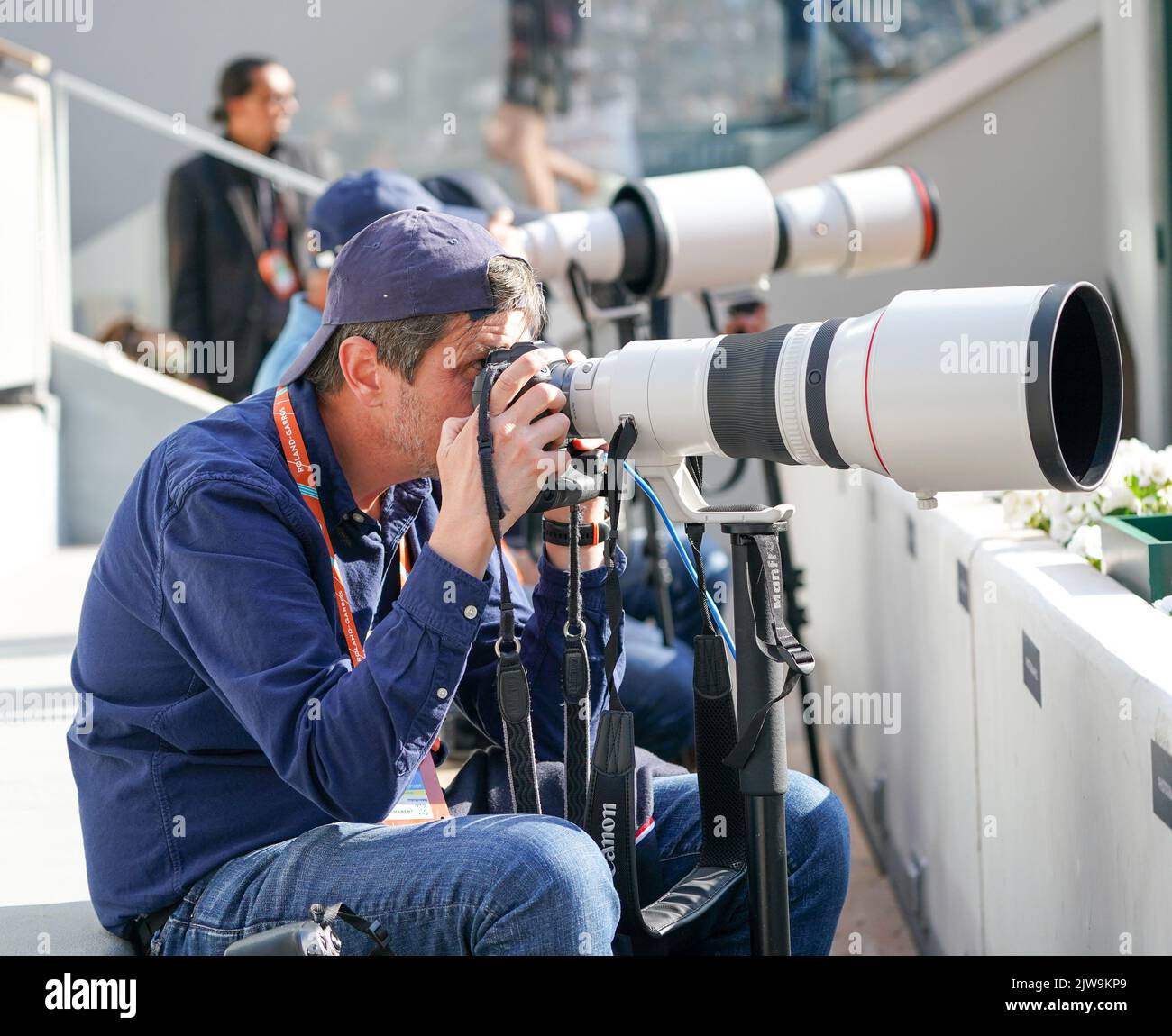 Professional sport photographer during tennis match at 2022 Roland ...
