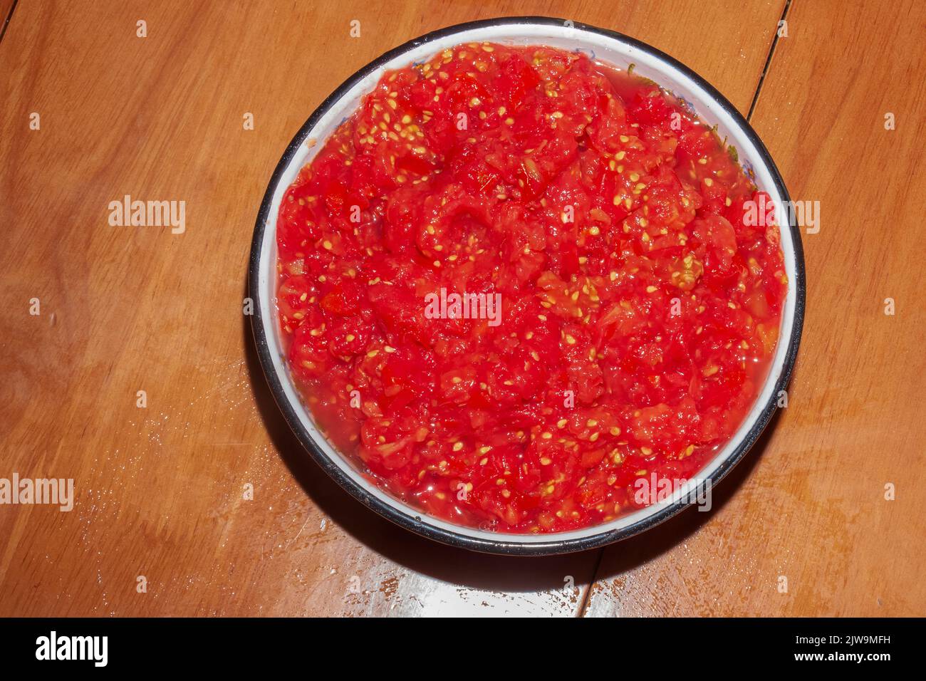 Freshly pressed tomatoes. The remains of tomatoes after processing in a ...