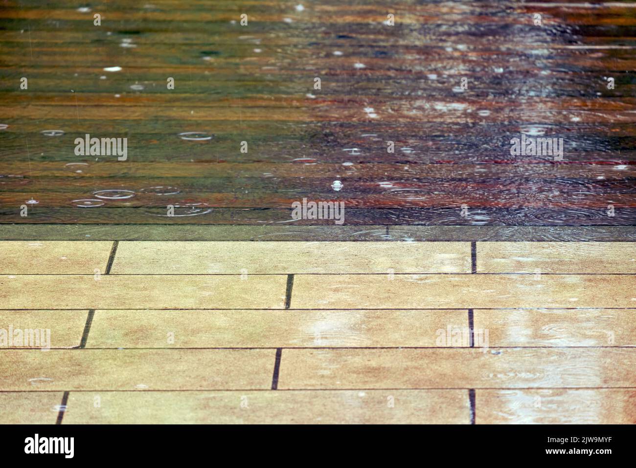 Wet wooden plank and stone tile floor with rain drops, background Stock ...