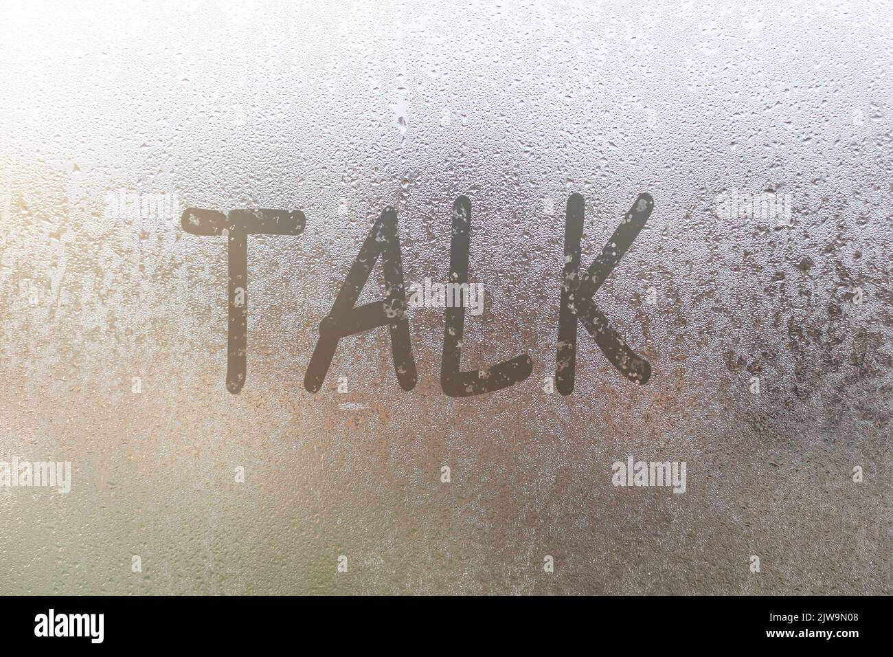 The word talk written on the sweaty glass of the window Stock Photo - Alamy