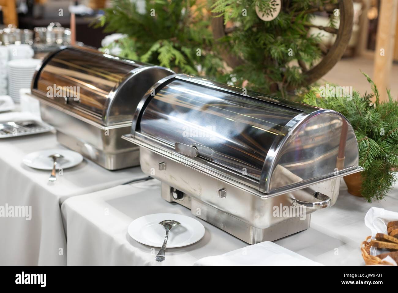 Food trays in buffet. metal containers buffet table Stock Photo - Alamy