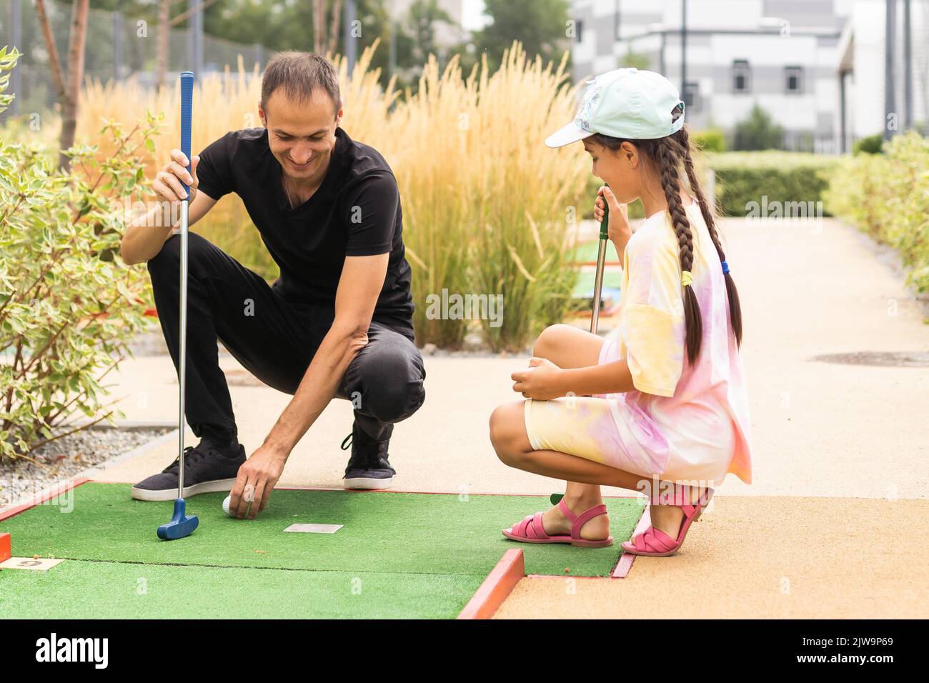 Closeup child golfer putter hi-res stock photography and images - Alamy