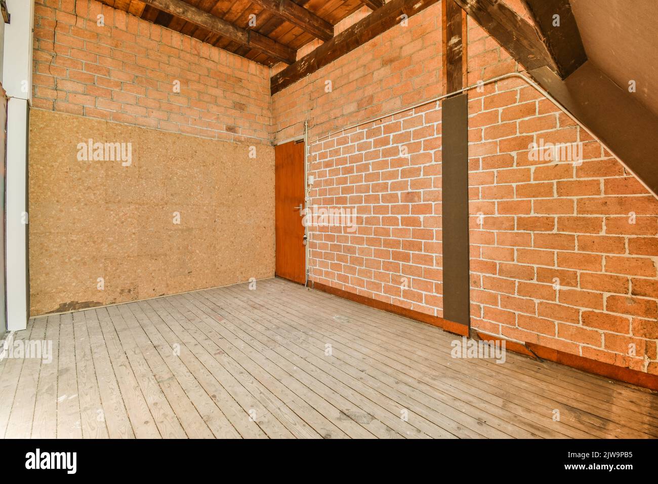 Interior of spacious apartment room on attic of building Stock Photo ...