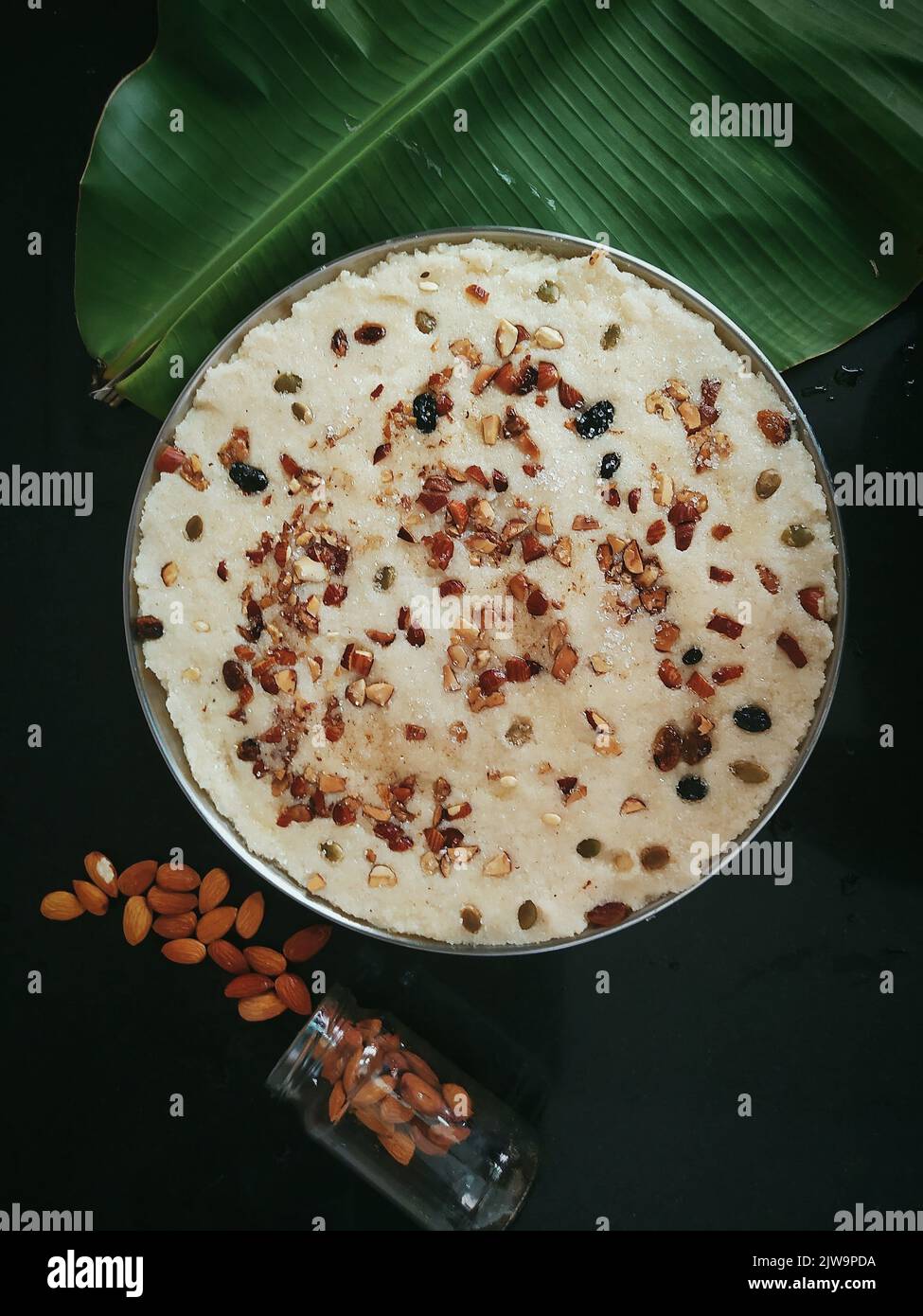 A vertical closeup of a cake with chopped almonds Stock Photo - Alamy