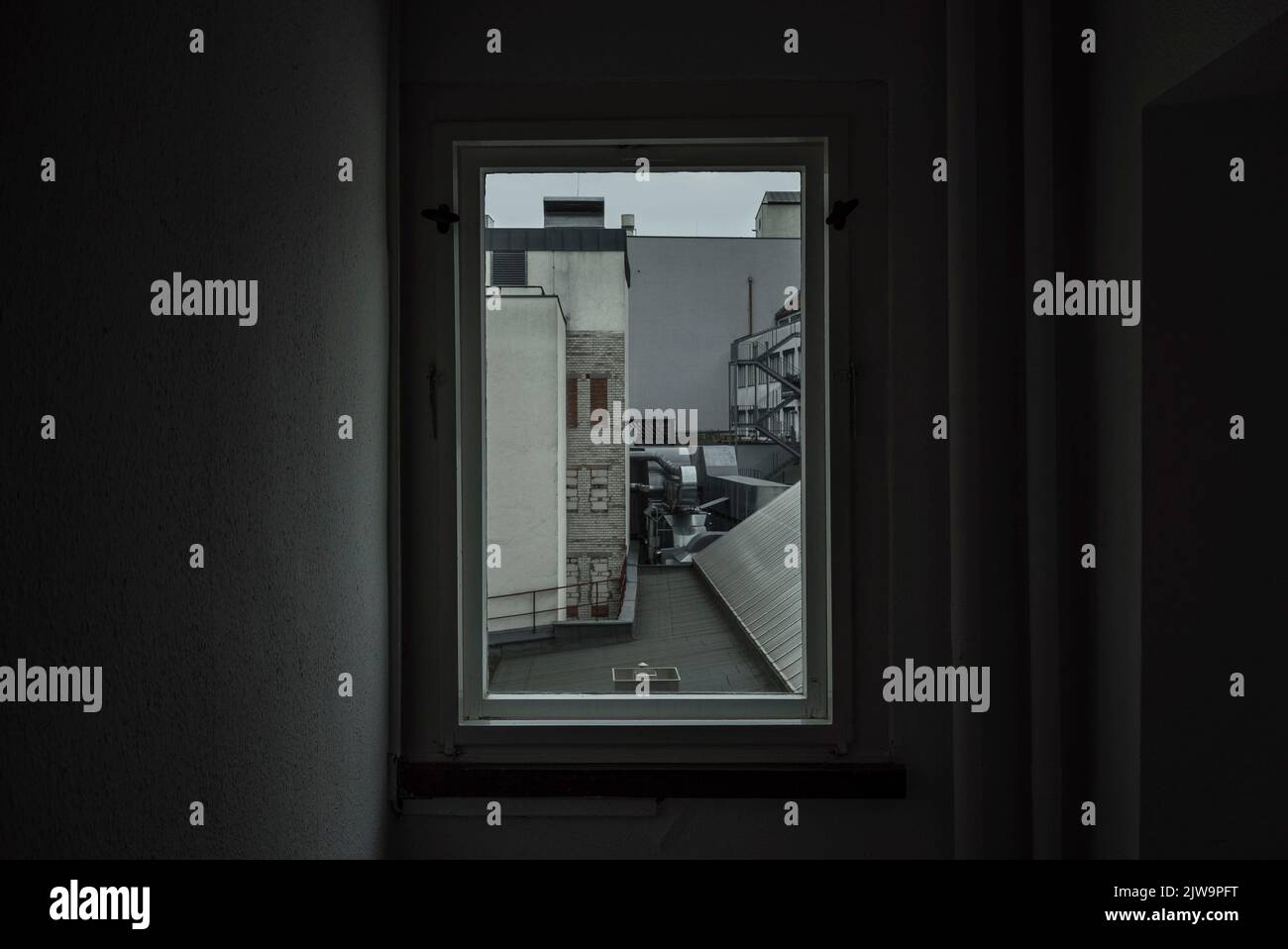 The view of the city buildings through the window frame Stock Photo - Alamy
