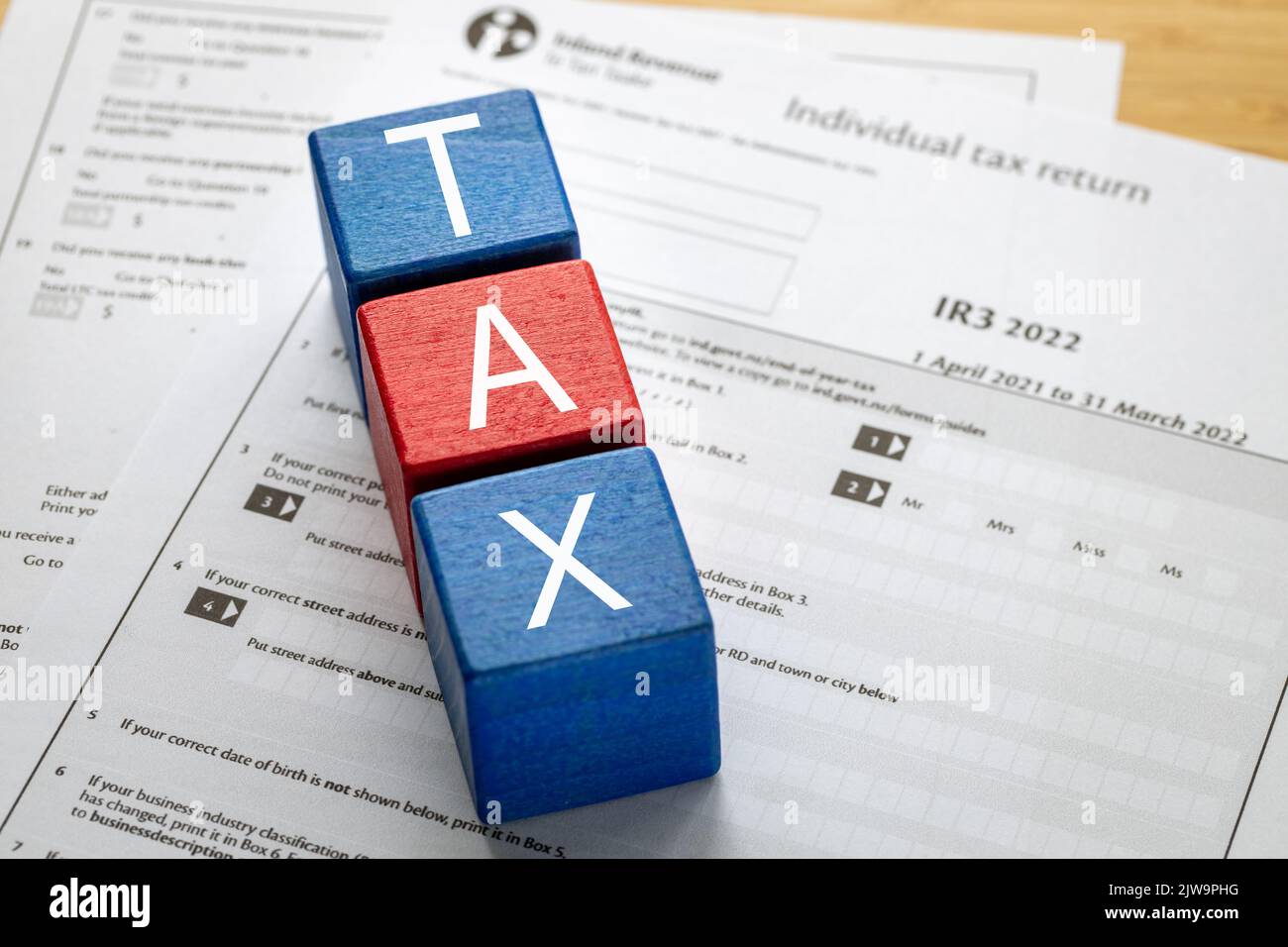 New Zealand tax return, Private form, Wooden blocks with the word Tax ...