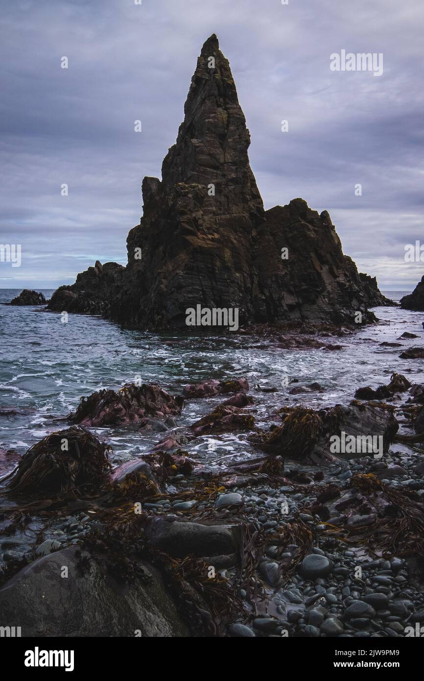 Sea gently touching rocky shore hi-res stock photography and images - Alamy
