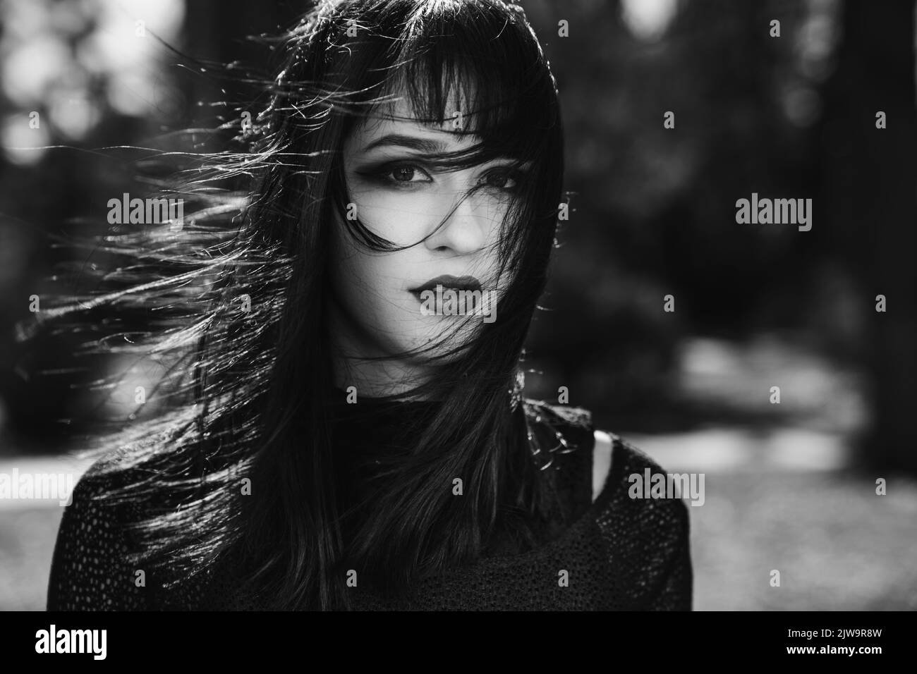 A Portrait of a pretty female in a gothic style looking at camera in ...