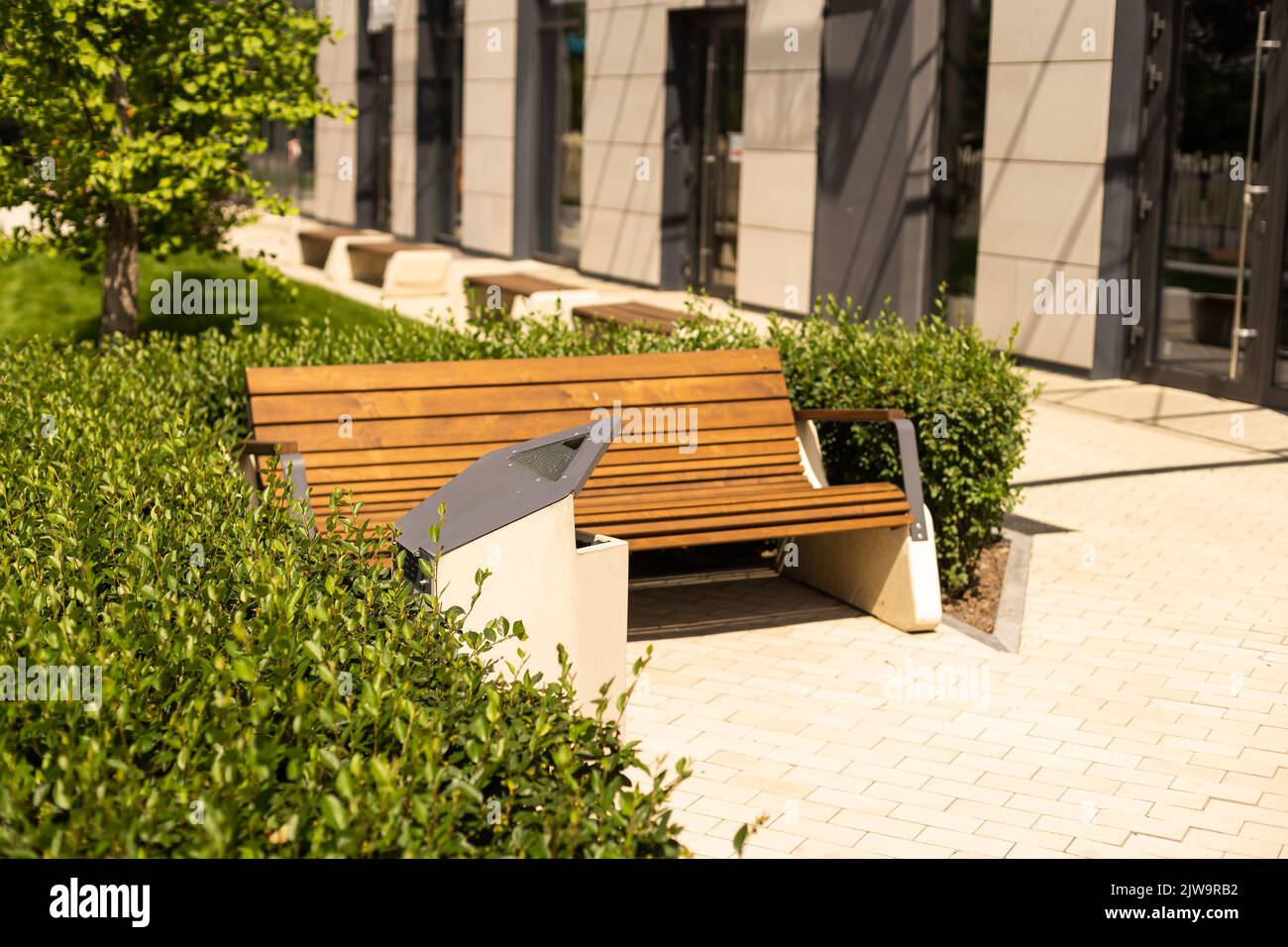 New modern bench in park. Outdoor city architecture, wooden benches ...