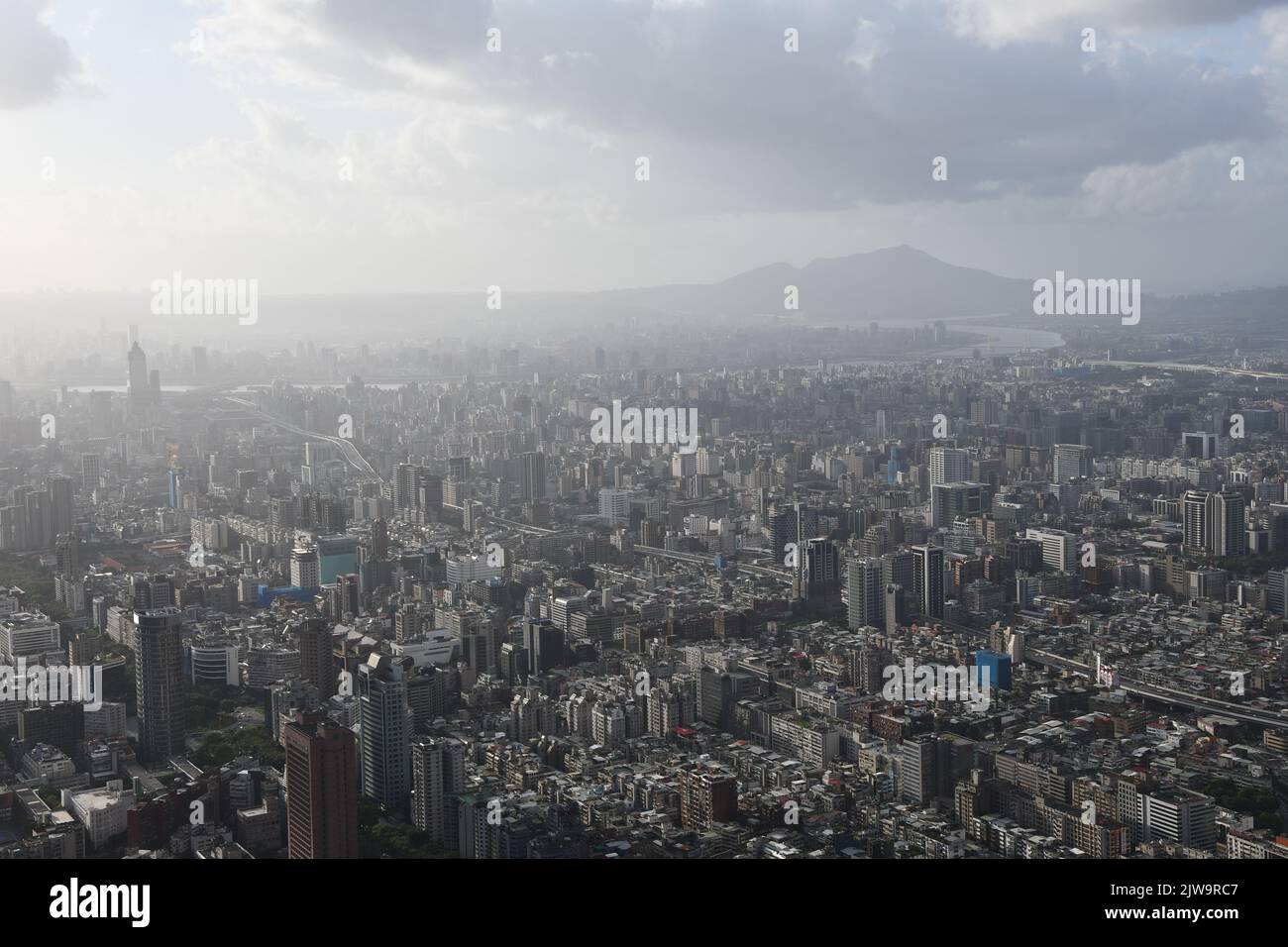 An aerial view of a beautiful city from the roof of Taipei 101 on a ...