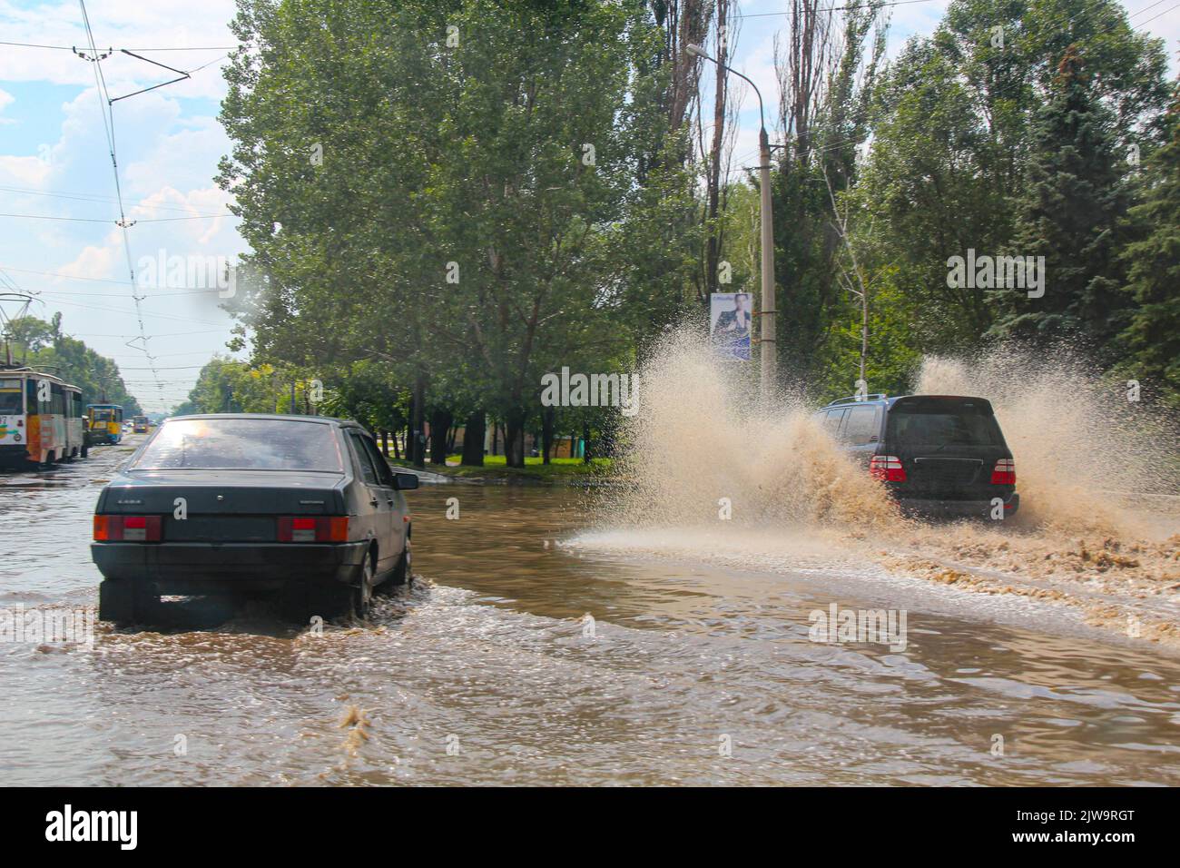 Flood. Road and cars under water. Heavy rain and downpour flooded city ...