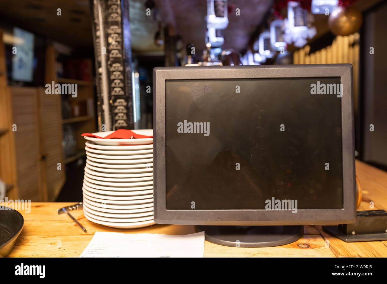 laptop on counter bar, room as background Stock Photo - Alamy