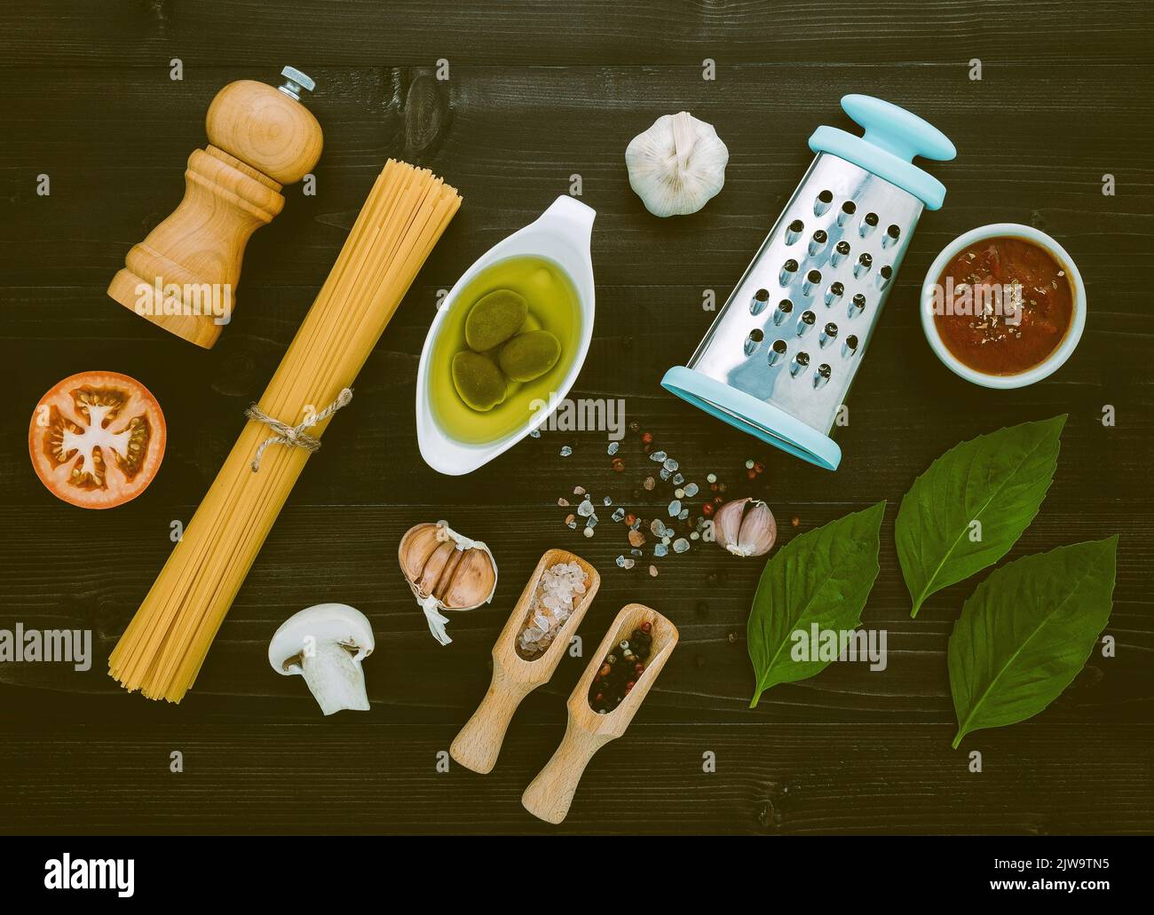 A top view of spaghetti and different food cooking equipment and ...