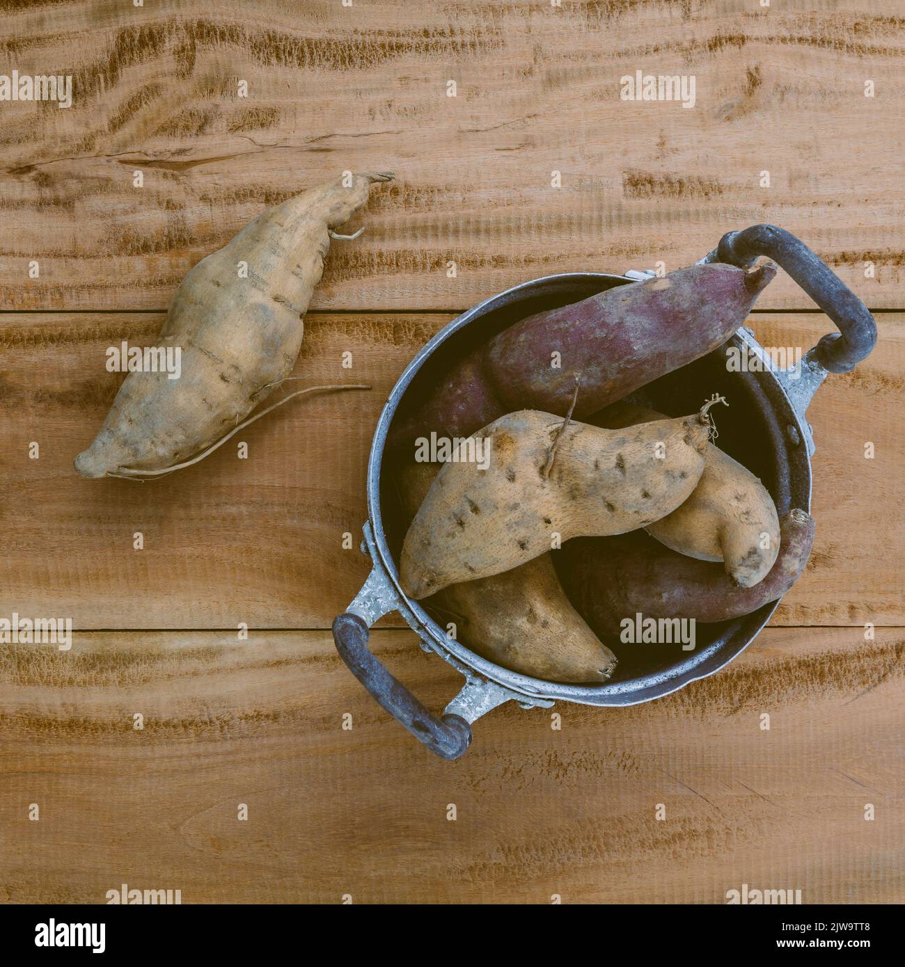 A top view of a pot filled with sweet and normal potatoes Stock Photo ...