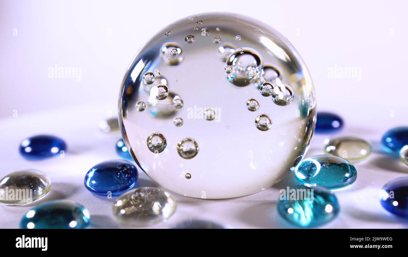 a magic ball for divination. blue glass ball close-up Stock Photo - Alamy