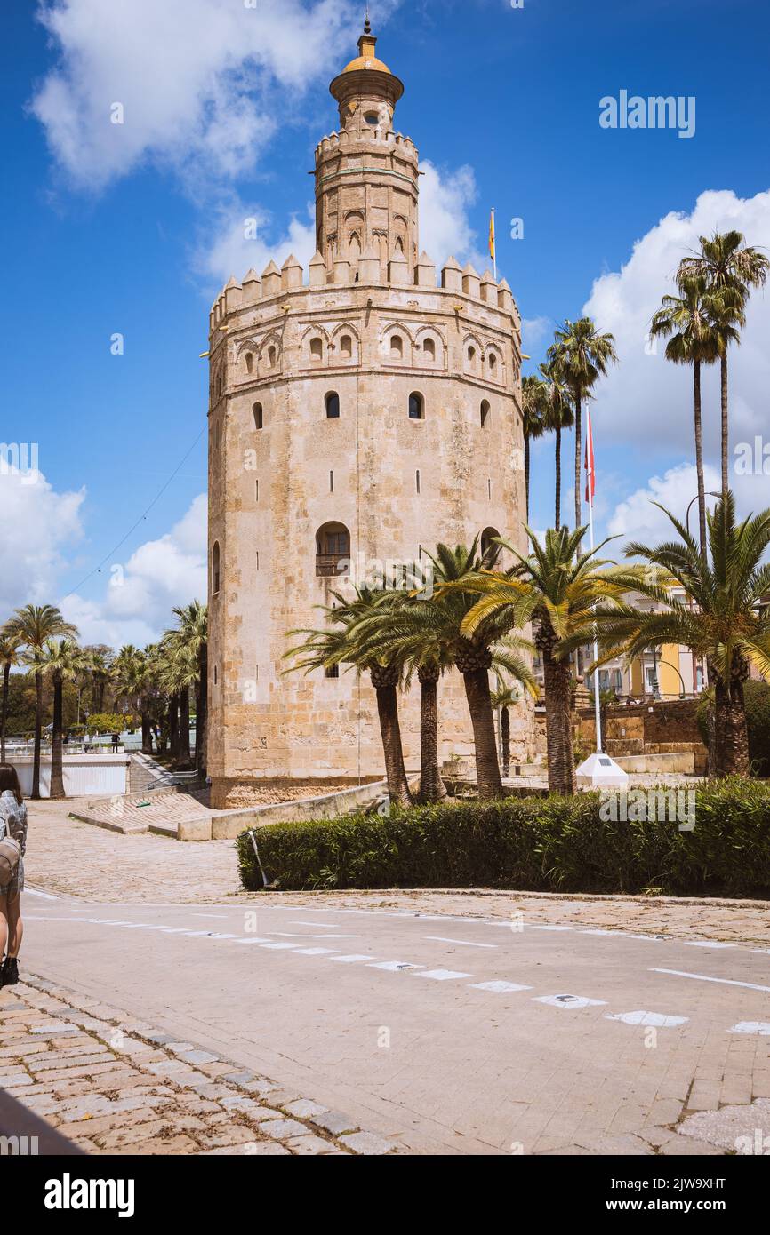 A vertical shot of the Tower of Gold in Spain with its surroundings ...